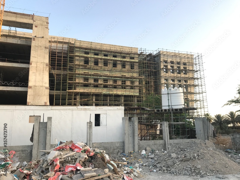 Project Site Construction under progress using tower crane and ...