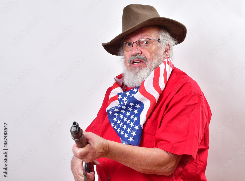 Angry old man, armed with a sawed off rifle, wearing patriotic colors ...