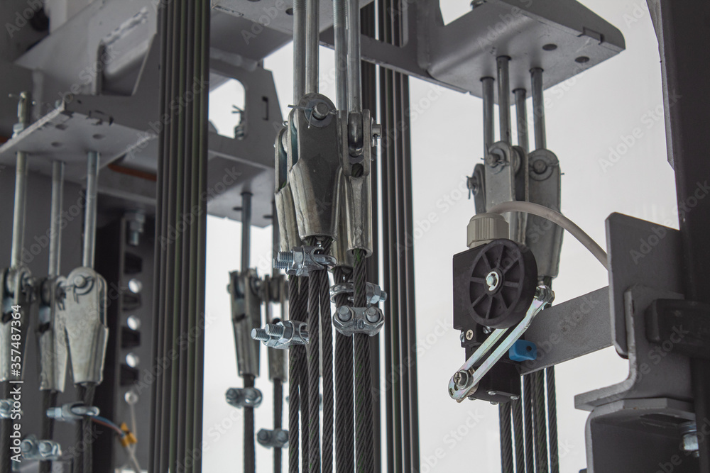Elements of fastening steel cables in the glass shaft of the elevator ...