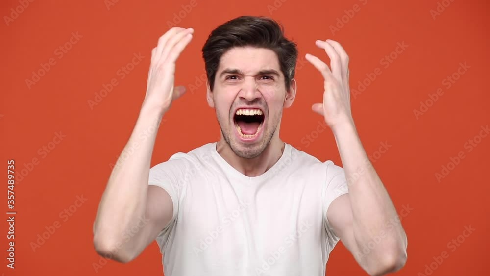 Angry swearing young guy 20s 30s years old in white t-shirt isolated ...