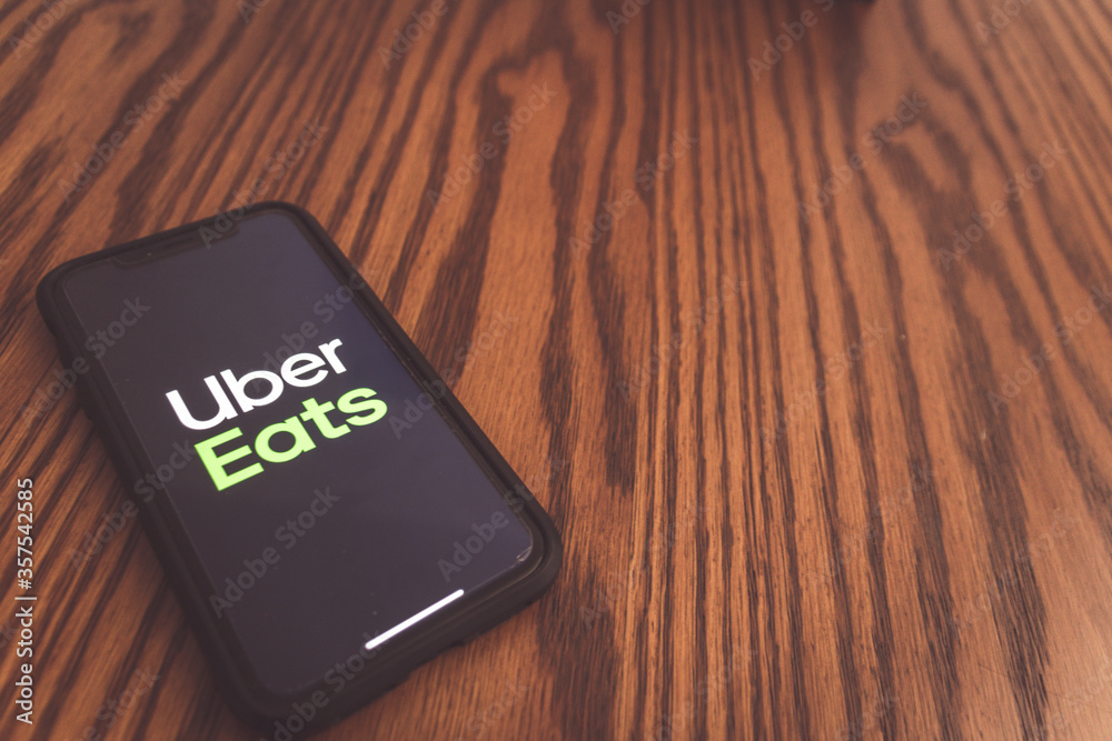 Uber eats logo on cellphone Stock Photo | Adobe Stock