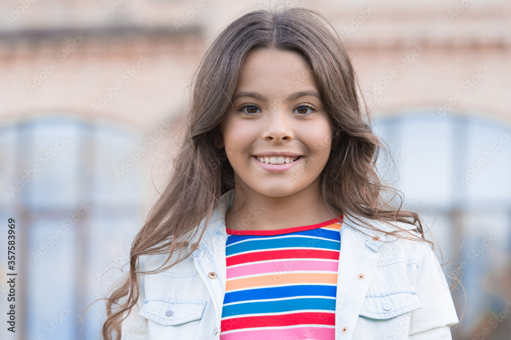 Beautiful inside and out. Happy child smile outdoors. Beauty look of ...
