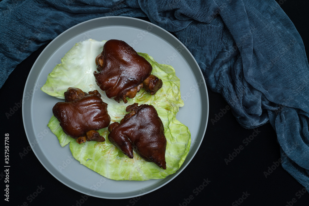 Chinese traditional delicacy marinated pig's feet.Braised pork trotters ...