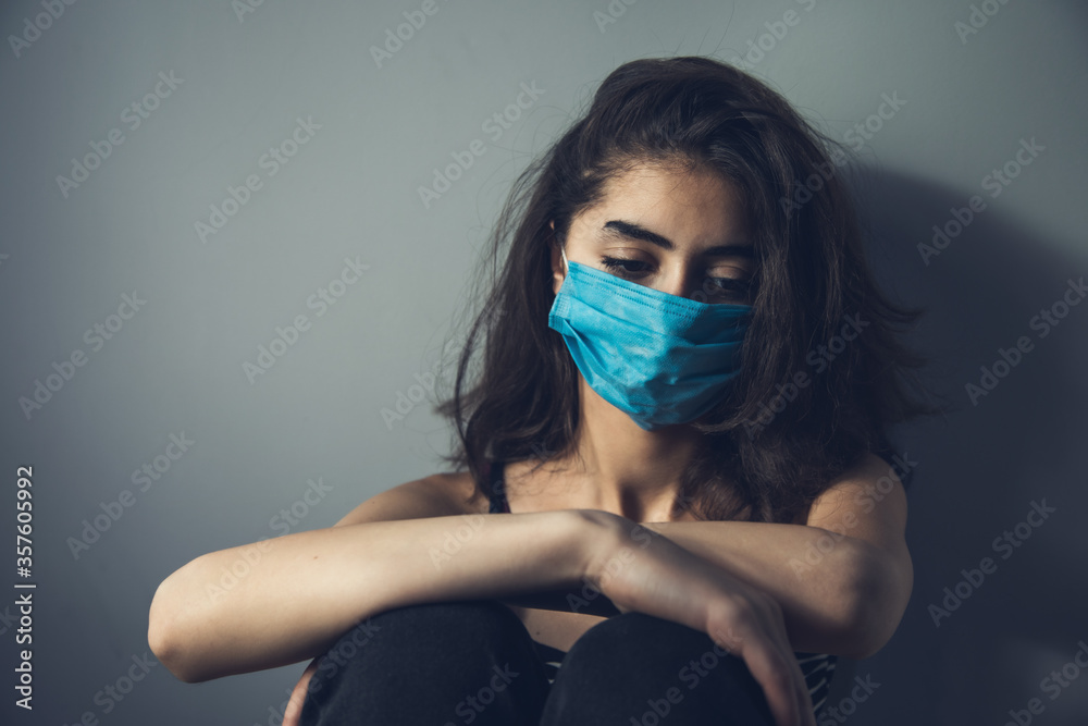Foto de sad woman face mask do Stock | Adobe Stock