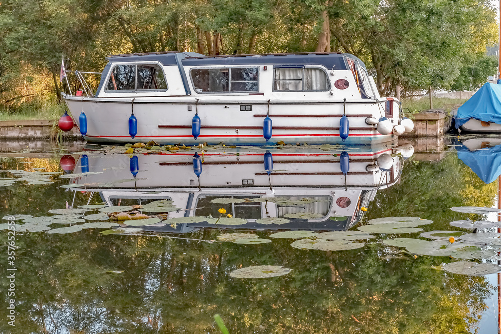 23 Small pleasure boat moored in the private staithe at Barton Turf in ...