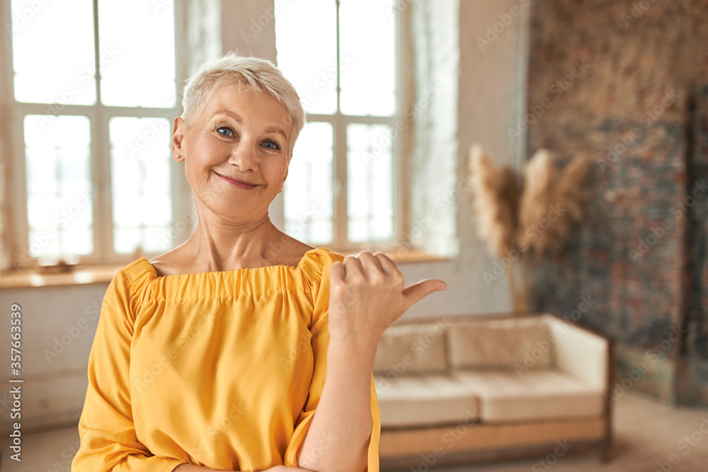 Beautiful successful middle aged female real estate agent with pixie ...