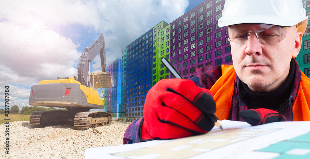Construction in full swing. Excavator next to unfinished building ...