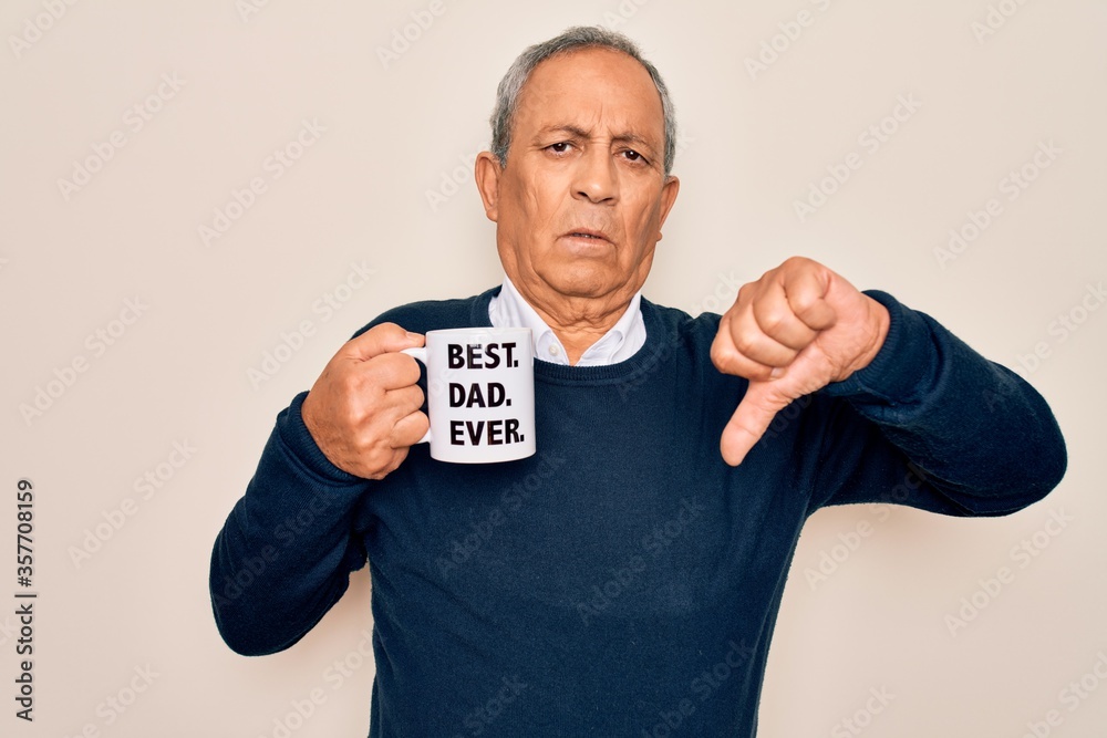 Senior man drinking cup of coffee with best dad ever message over white ...