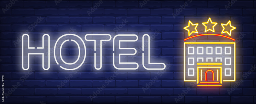 Hotel neon sign. Hotel building with three stars on brick wall ...