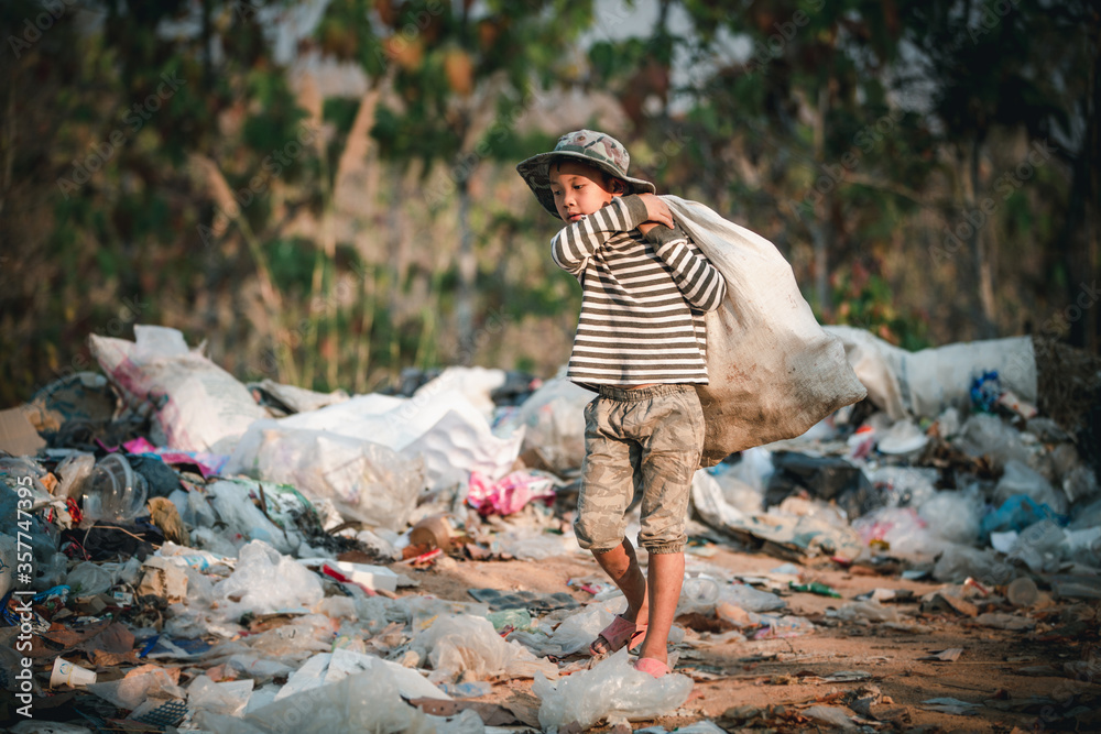 Child labor. Children are forced to work on rubbish. Poor children ...