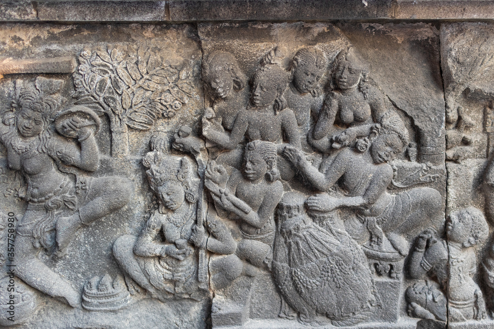 Wall carvings on stone at Prambanan hindu temples. Scenes about hindu ...