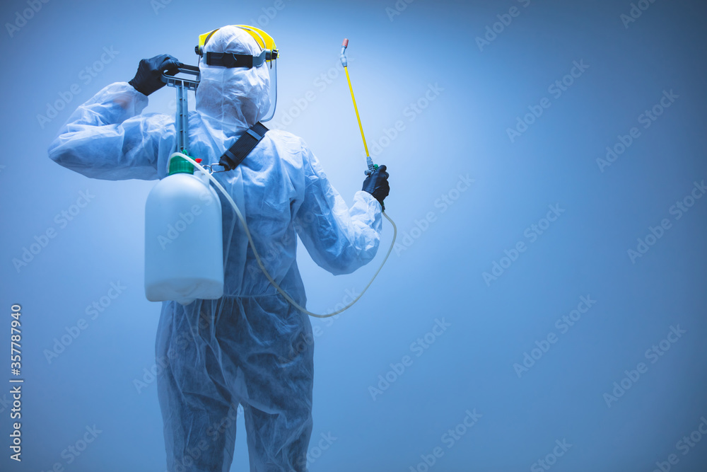 Scientist holding chemical sprayer for sterilization and ...