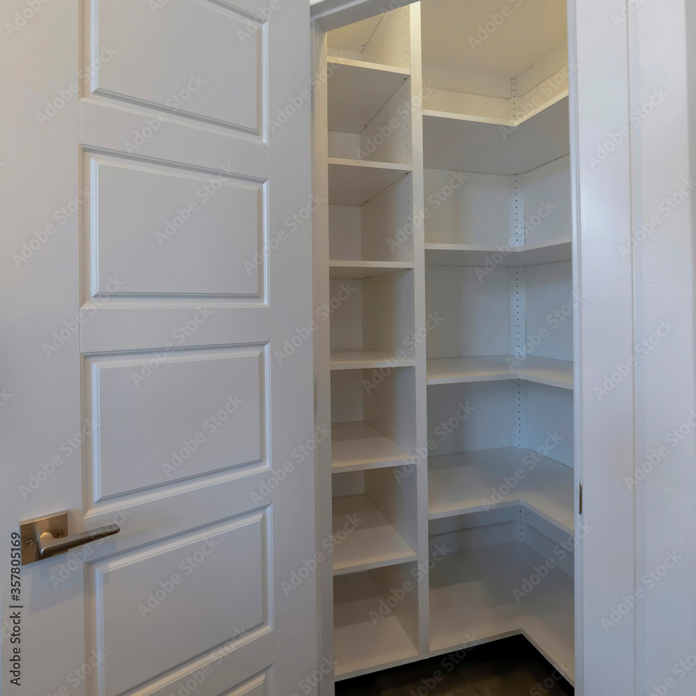 Square frame Small pantry with empty wall shelves at the corner of the ...