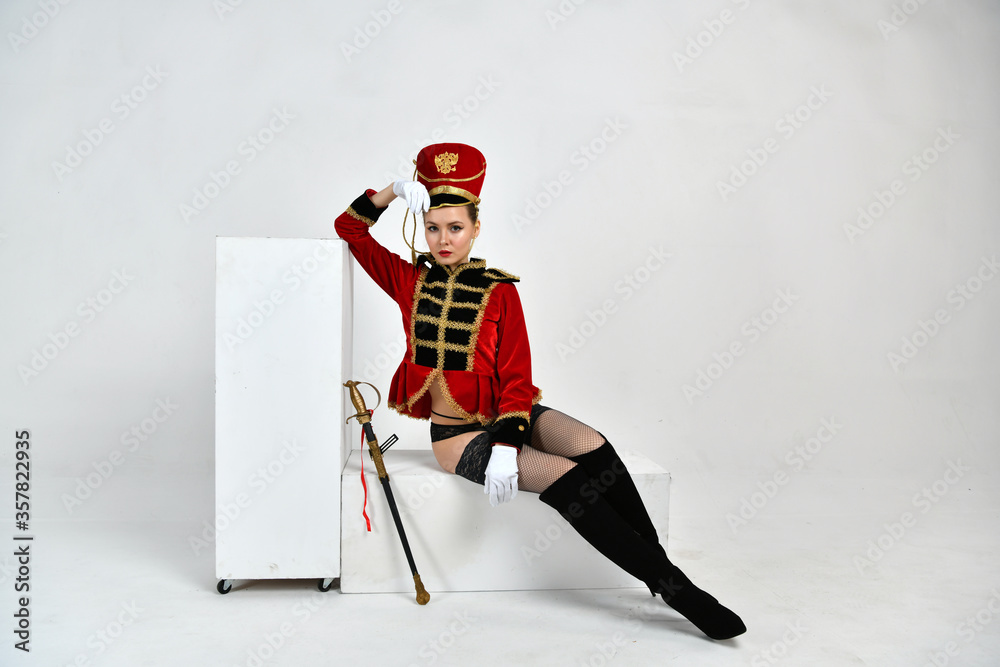 beautiful girl in a red hussar costume with a sword Stock Photo | Adobe ...