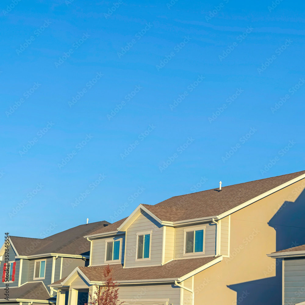 Square frame Homes with horizontal wall sidings and front gable roofs ...