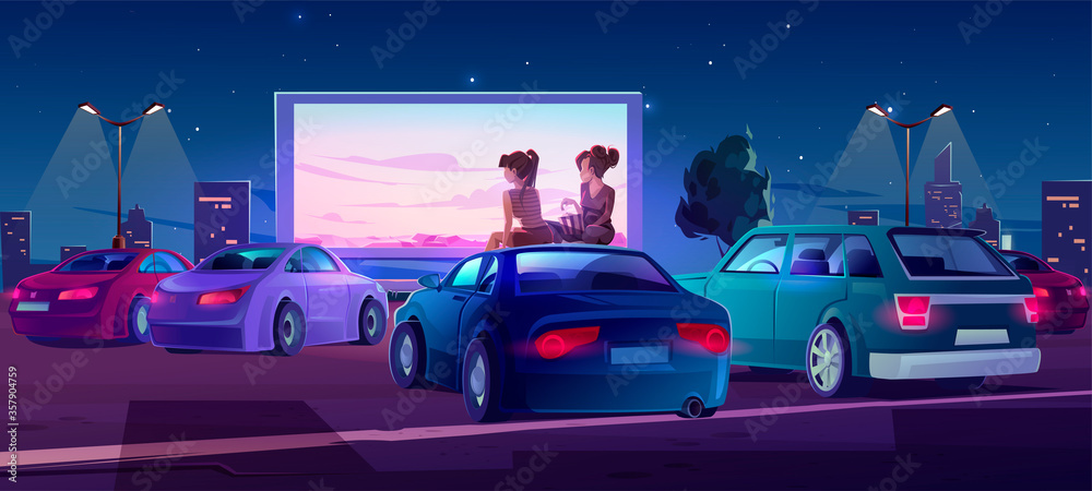 Outdoor cinema, drive-in movie theater with cars on open air parking ...