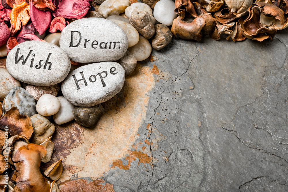 Background. Dream, Wish, Hope. Stones with words written on them ...
