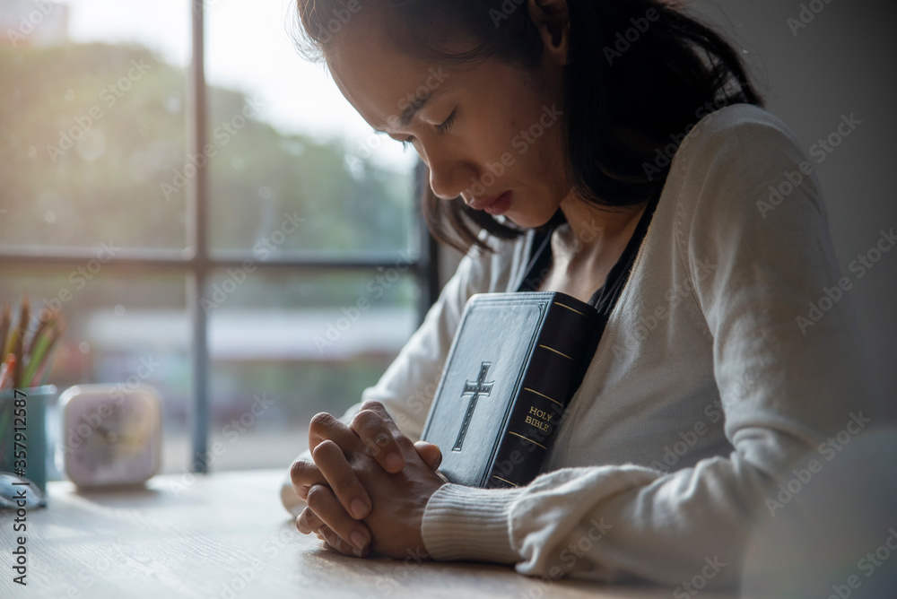 Prayer and bible in New Normal concept. Asian female wear medical mask ...