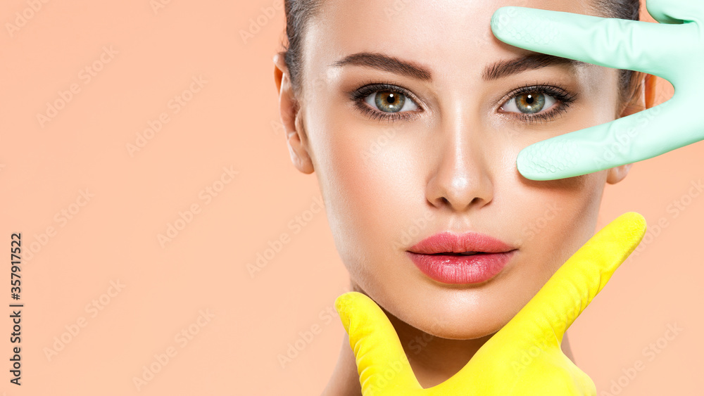 Face skin check before plastic surgery. Beautician touching young woman ...