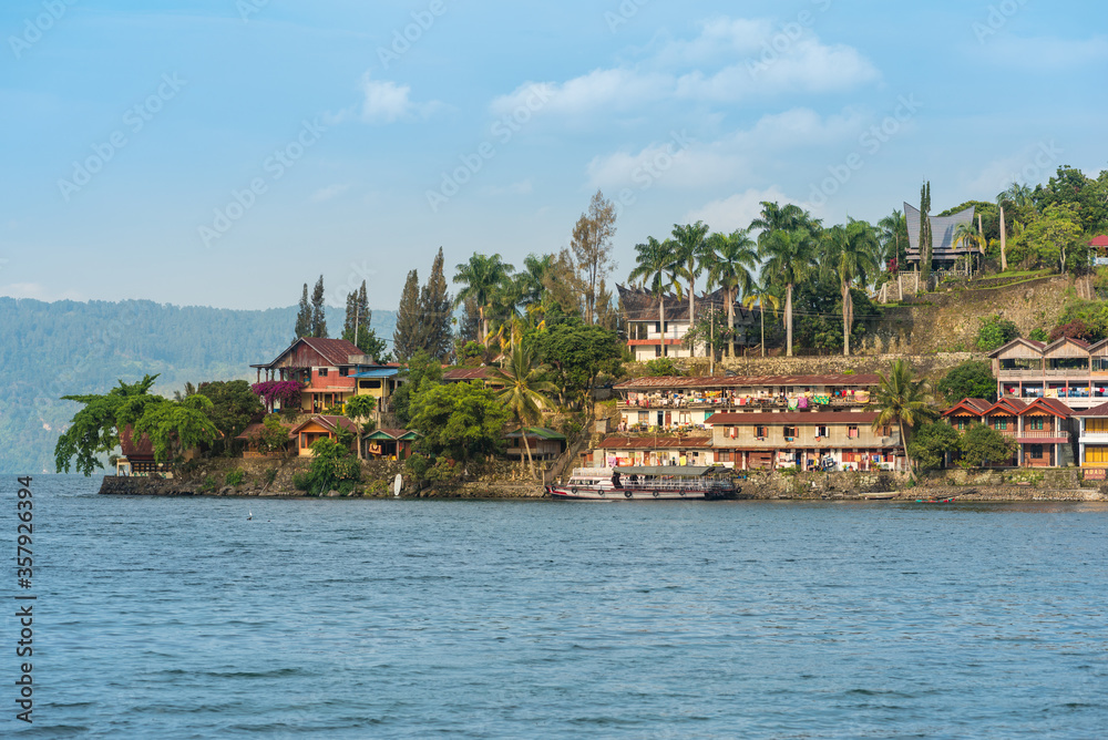 The north-west shore of the peninsula Tuktuk with the tourist resorts ...