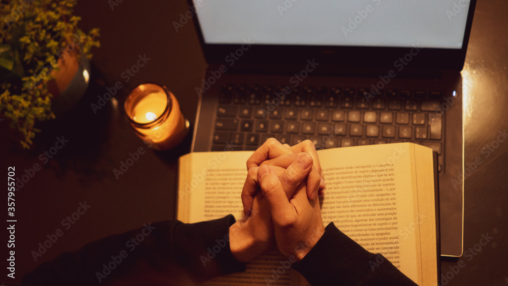 Mass online. prayer online. prays in front of a computer. Stock Photo ...