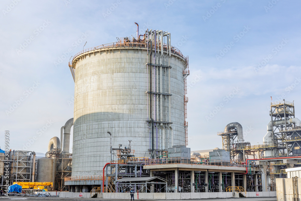 View of the double walled, vertical, cylindrical ammonia storage tank ...