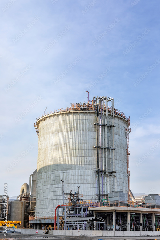 View of the double walled, vertical, cylindrical ammonia storage tank ...