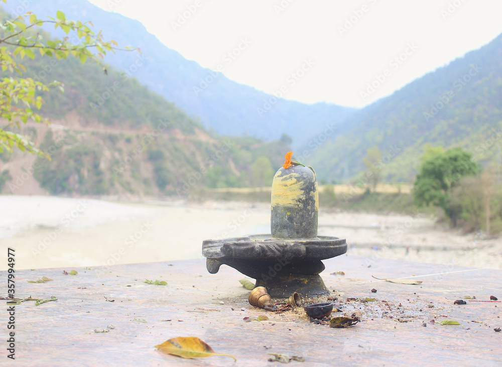 shiva linga in the river bank. this pic is taken in uttarakhand, india ...