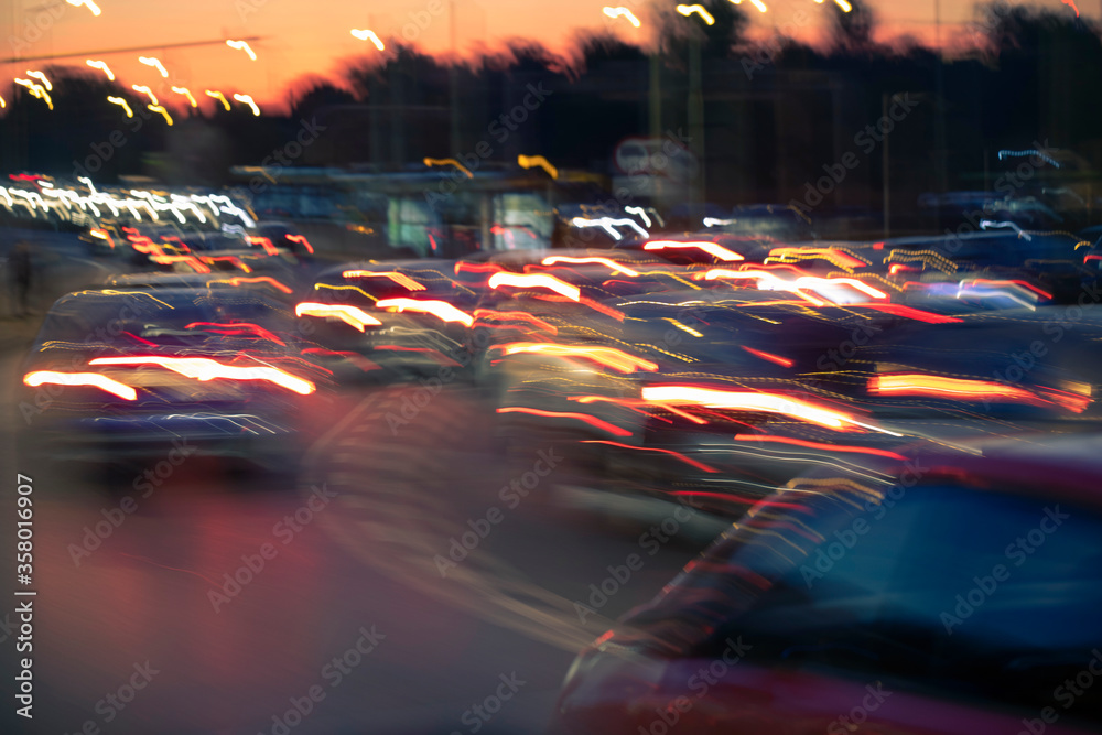 Traffic jam, colorful city and cars lights, blurred by speed and motion. A streak of light ...