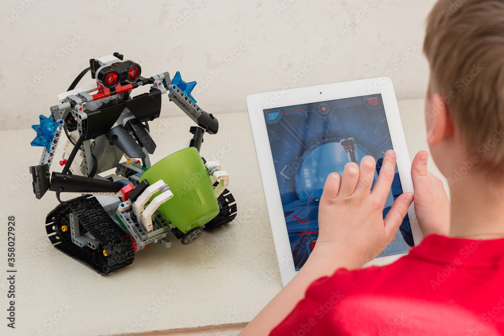 Minsk, Belarus. March, 2018. Boys construct and code robots. Lego ...