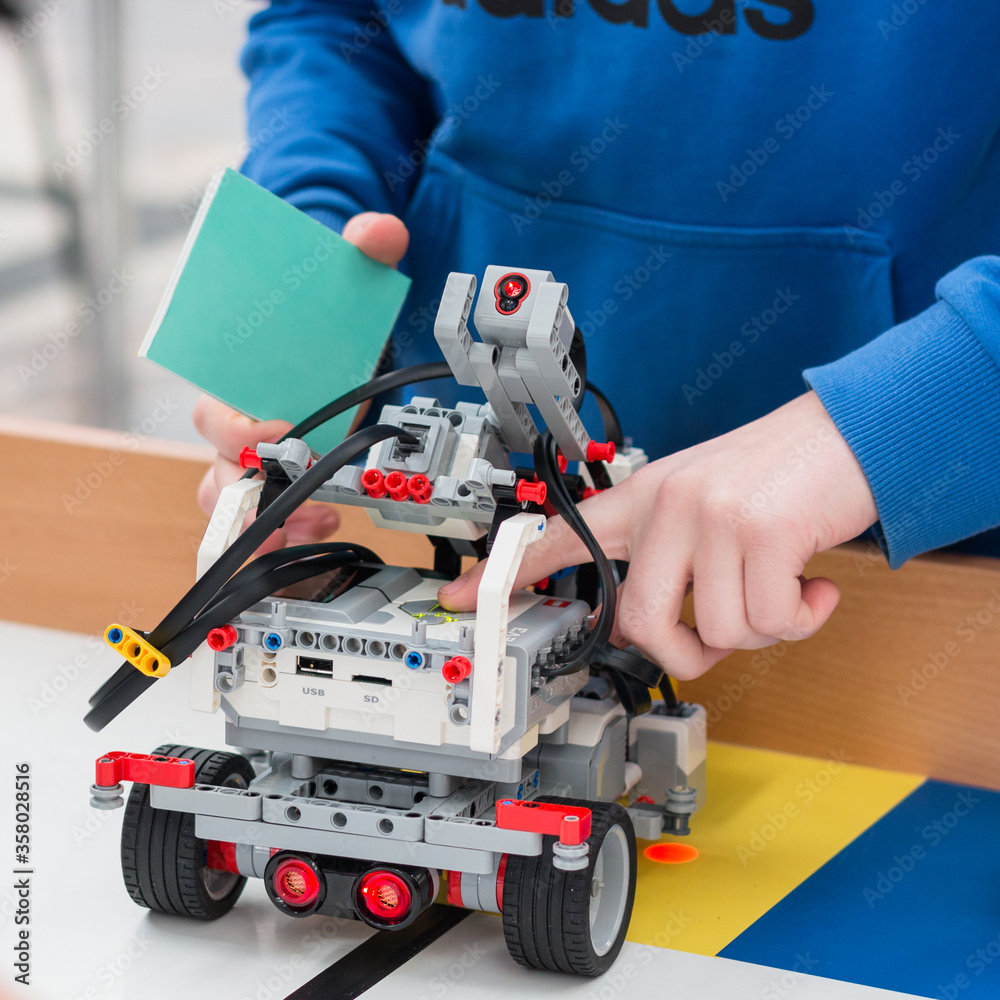 Minsk, Belarus. March, 2018. Boys construct and code robots. Lego ...