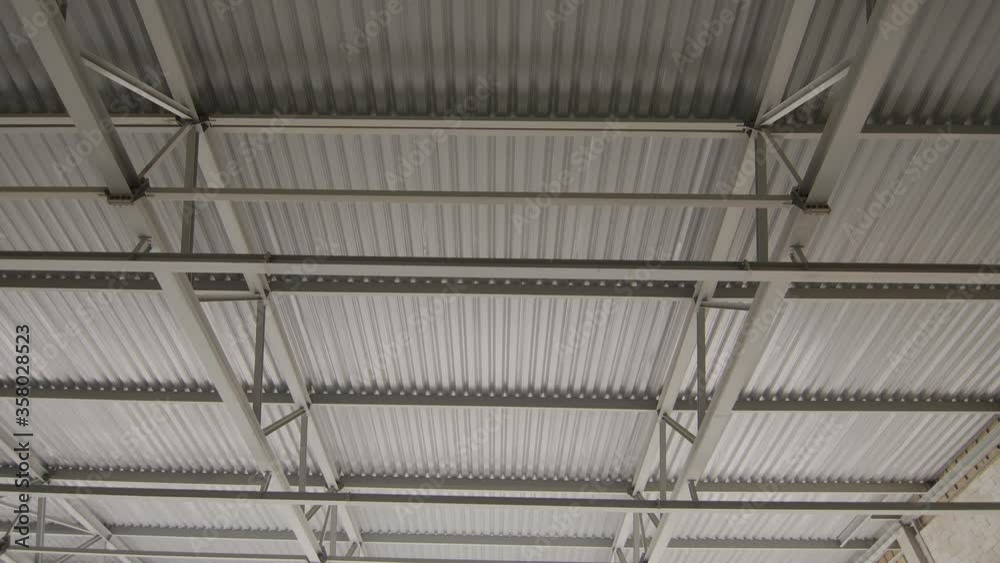 Ceiling of metal construction of a large modern room. Panorama of iron ...