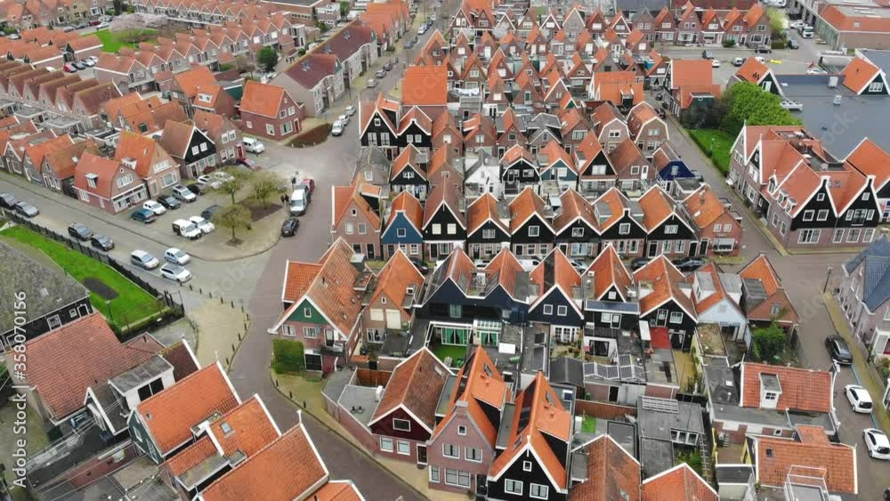 Aerial flying above the typical Dutch houses of Volendam showing the ...