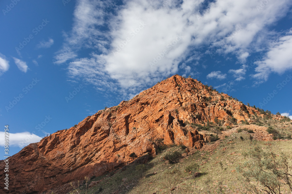Foto de Triangle mountain formed by orange and red rock. Green ...