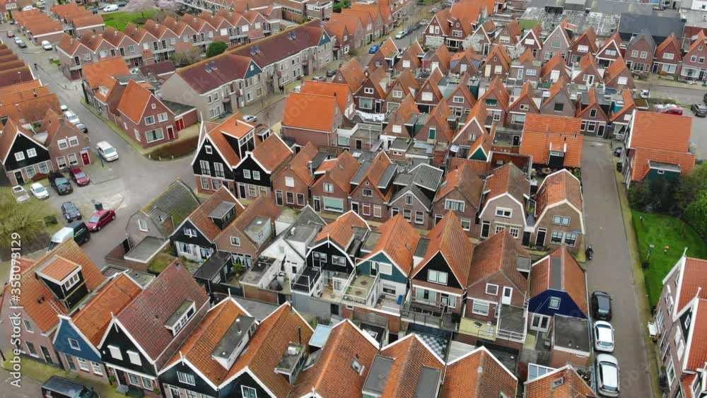 Aerial flying above the typical Dutch houses of Volendam showing the ...
