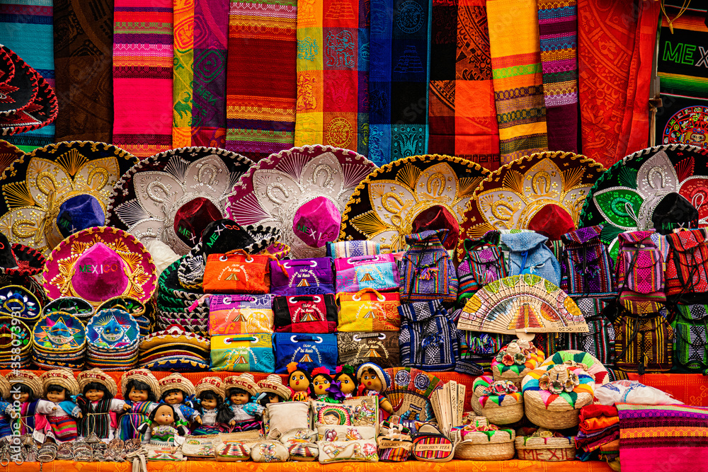 Colorful mexican souvenirs at the market stall at Chichen-Itza ...