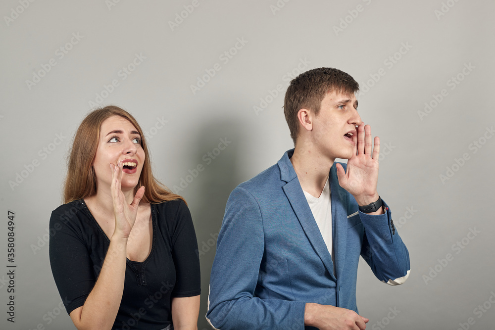 Scream and shout holding hands near opened mouth. Screaming loudly with ...