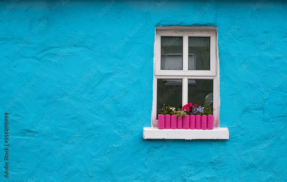 Irish cottage background, window with flower box, blue wall background ...