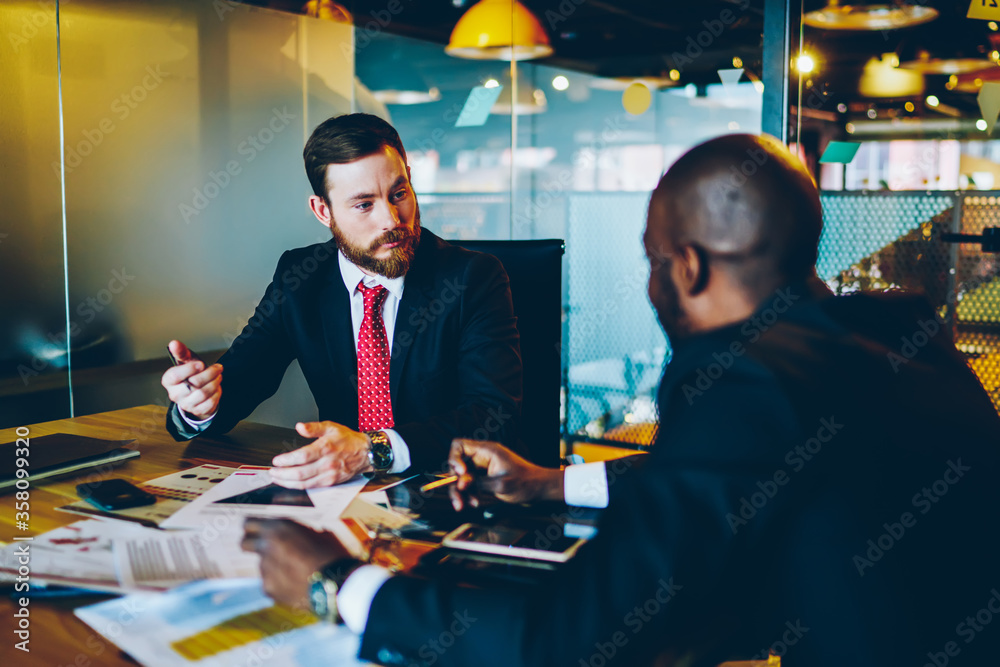 Serious proud ceo having formal meeting with investor discussing ...