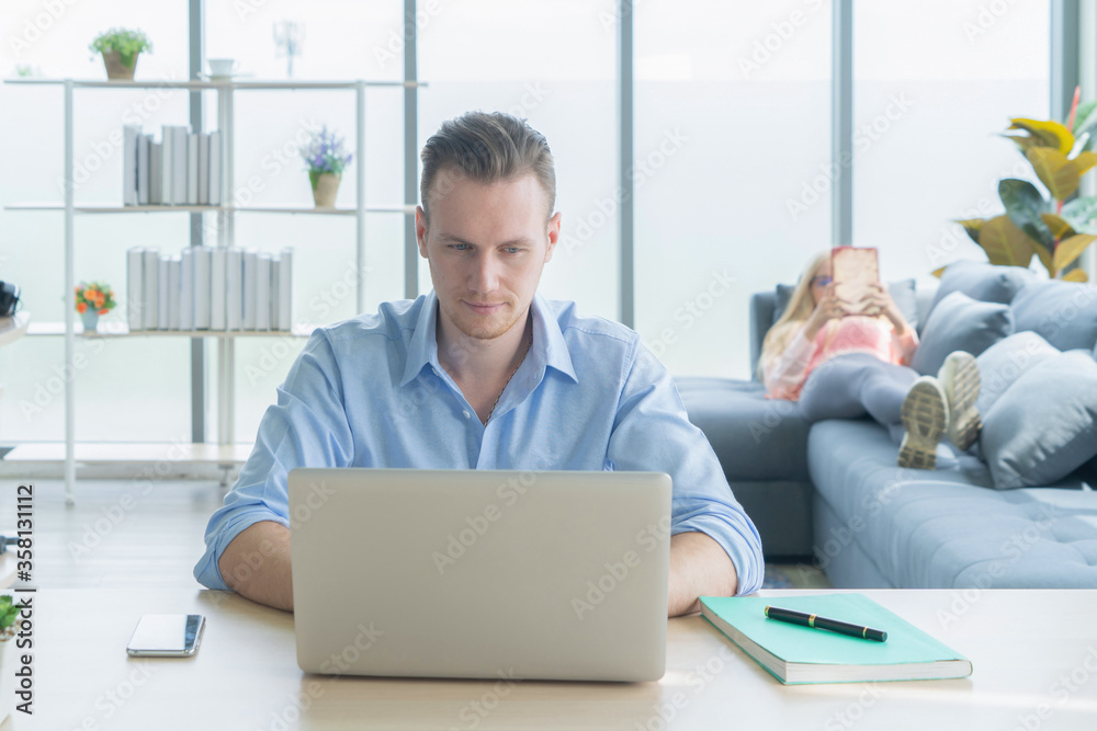 Smiling business blonde, white man person working from home on table ...