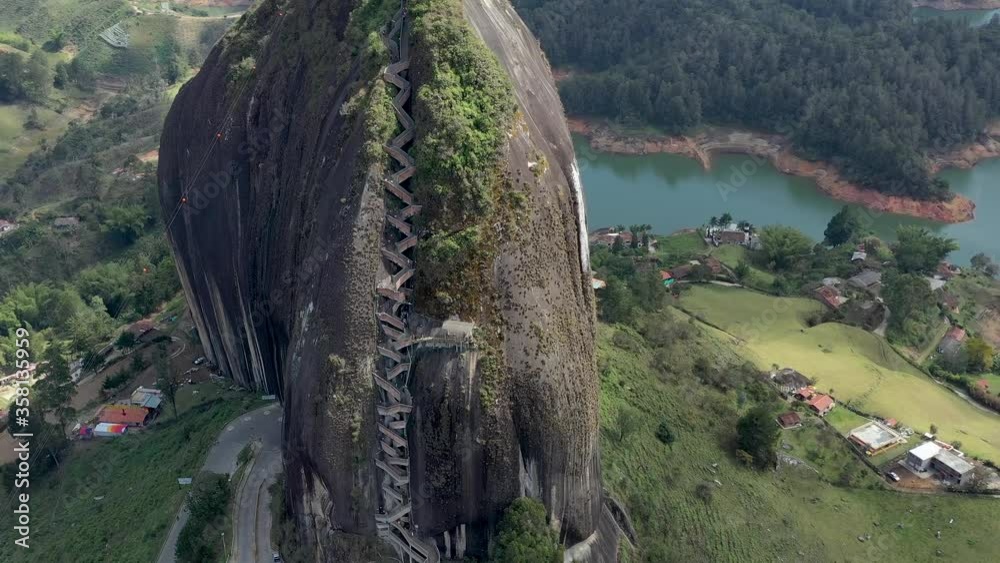 El Peñón de Guatapé in Colombia aerial drone video. Orbiting shot over ...