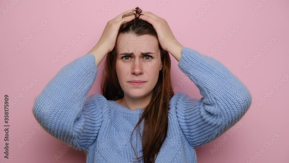 Nervous puzzled woman grabs head, has terrible pain, realizes something ... Nervous puzzled woman grabs head, has terrible pain, realizes something ...