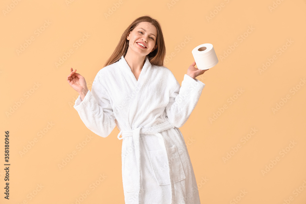 Young woman with toilet paper on color background Stock Photo | Adobe Stock