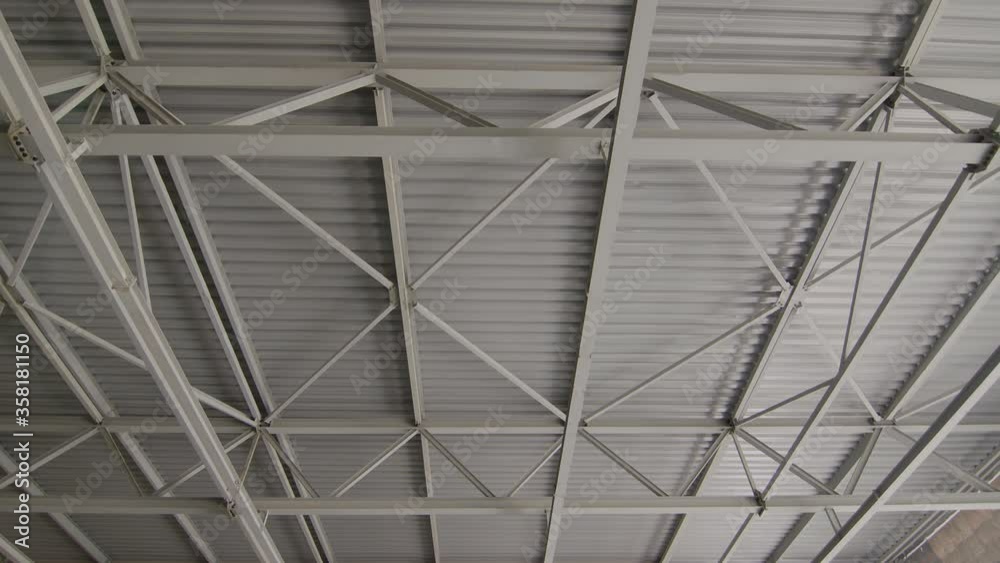Ceiling of metal construction of a large modern room. Panorama of iron ...