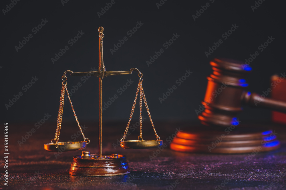 Scales of justice and gavel on table of notary public Stock Photo ...