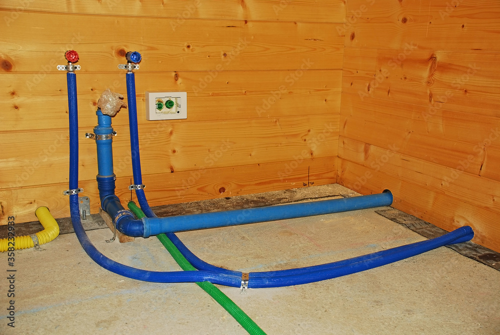 Piping for a kitchen sink connection in a newly built wooden (fir ...