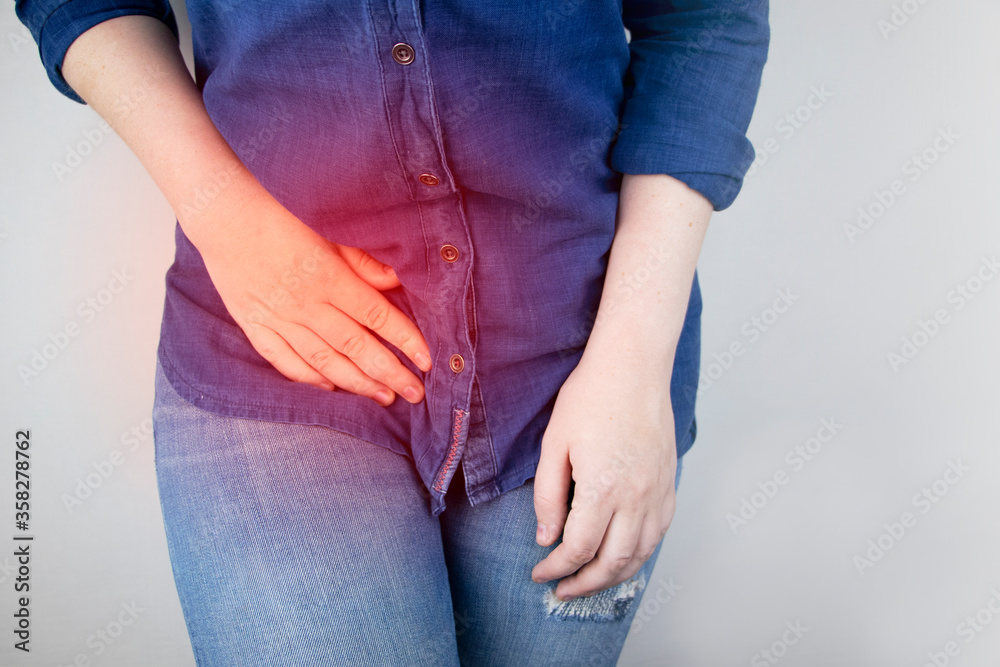 A woman suffers from pain in the appendix. Acute appendicitis, Crohn's ...