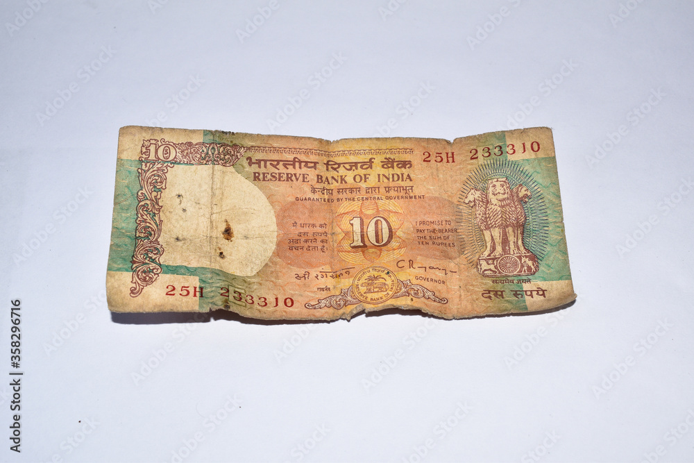 Old 10 rupees Indian currency note on white background. Stock Photo ...