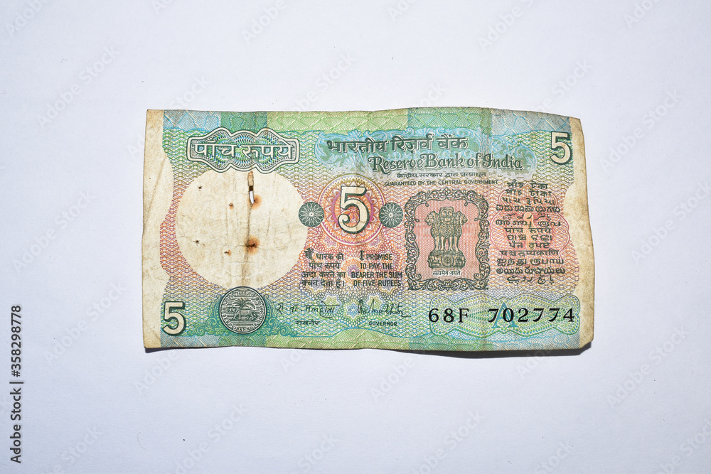 Old 5 rupees Indian currency note on white background. Stock Photo ...