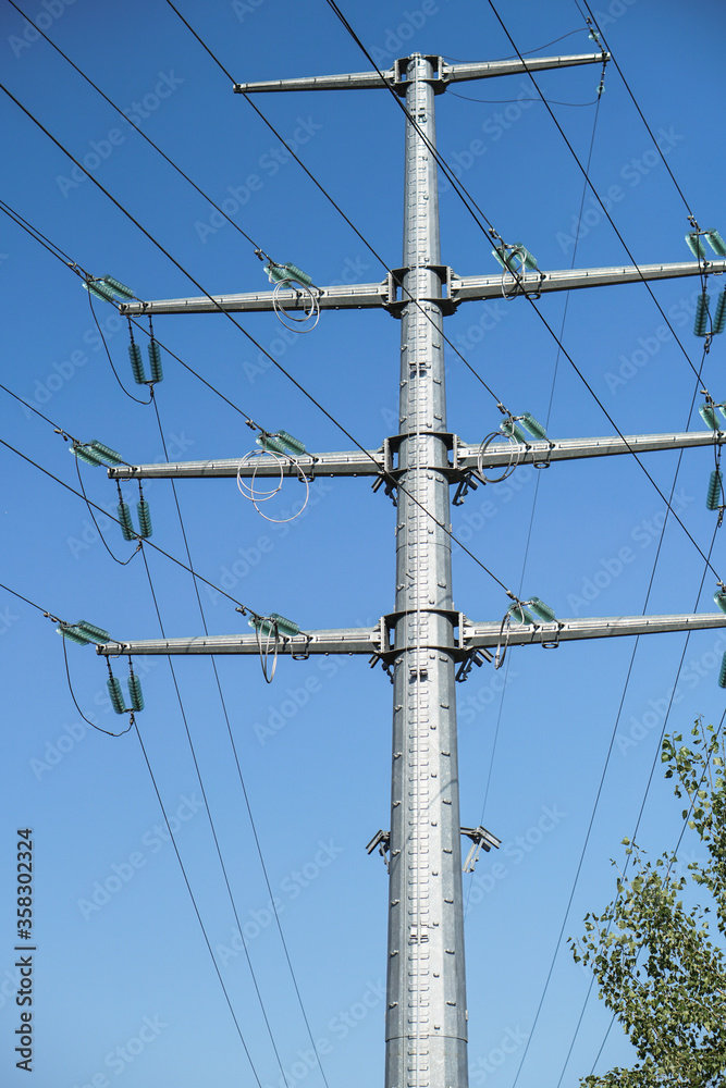 High voltage pole with wires through which electricity flows. Power ...